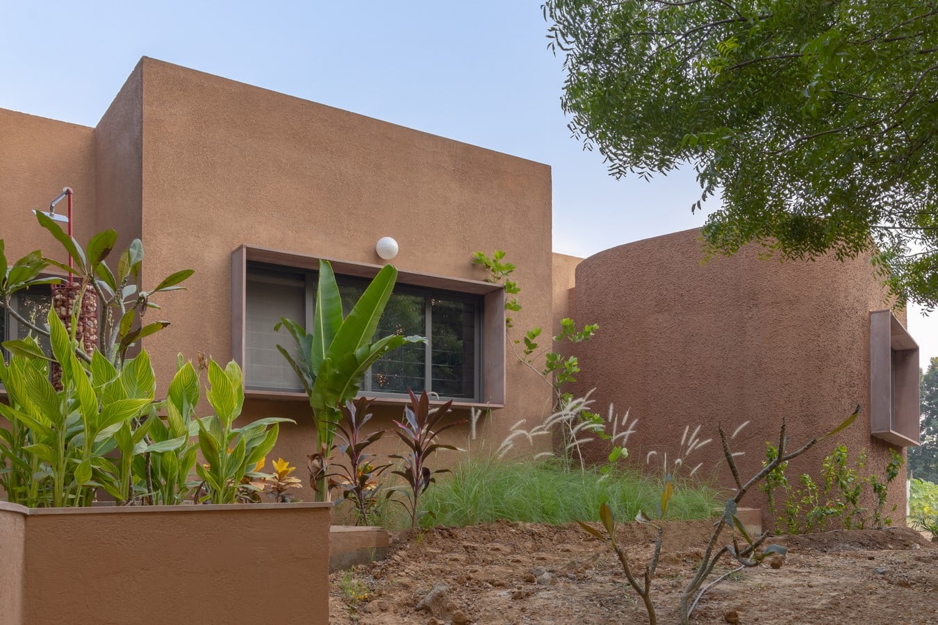 Courtyard by the Water- A nature focused courtyard with a house by ...